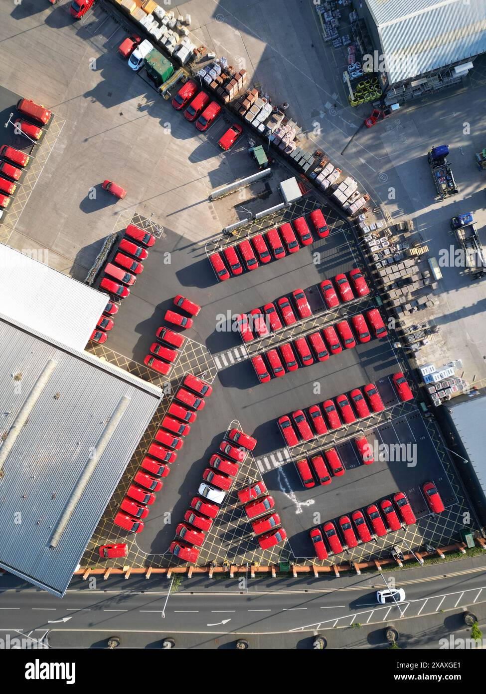 Aerial view from drone of Royal Mail delivey vehicles and vans parked ...