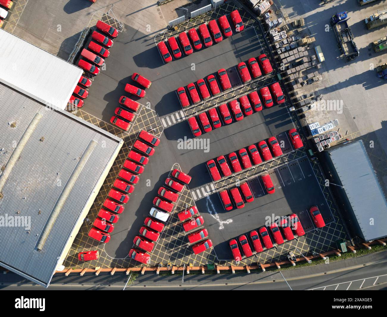 Aerial view from drone of Royal Mail delivey vehicles and vans parked ...