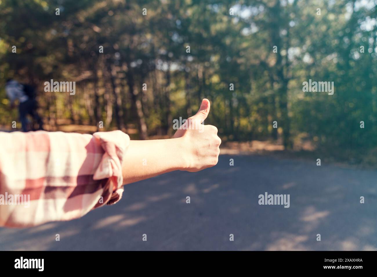 hitchhiking woman's hand Stock Photo - Alamy