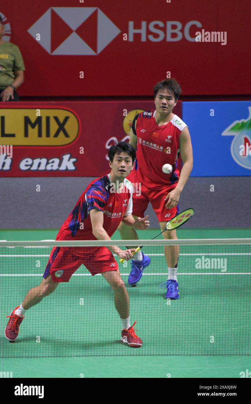 Jakarta, Indonesia. 9th June, 2024. Liang Weikeng (R)/Wang Chang compete during the men's ...