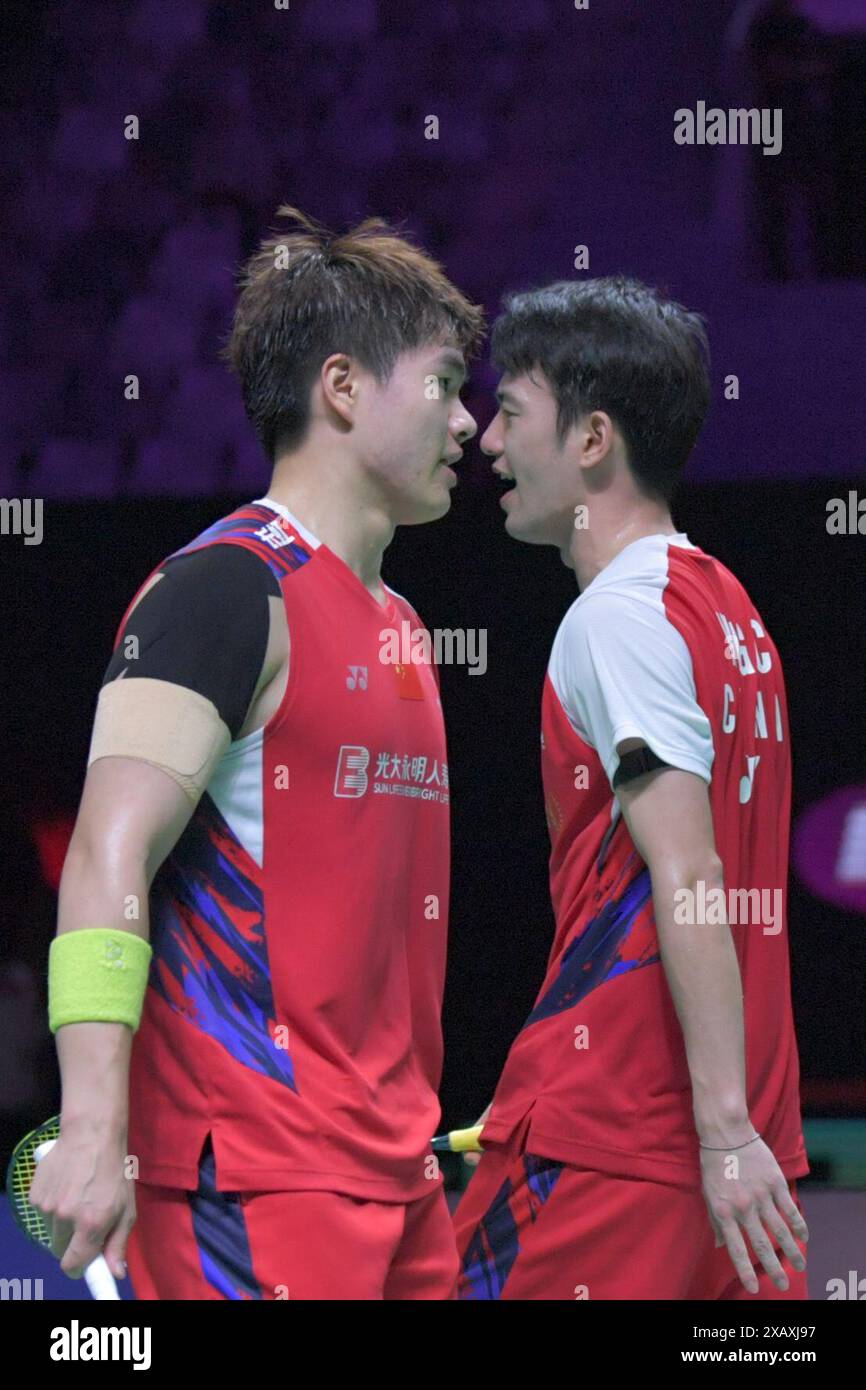 Jakarta, Indonesia. 9th June, 2024. Liang Weikeng (L)/Wang Chang react during the men's doubles ...