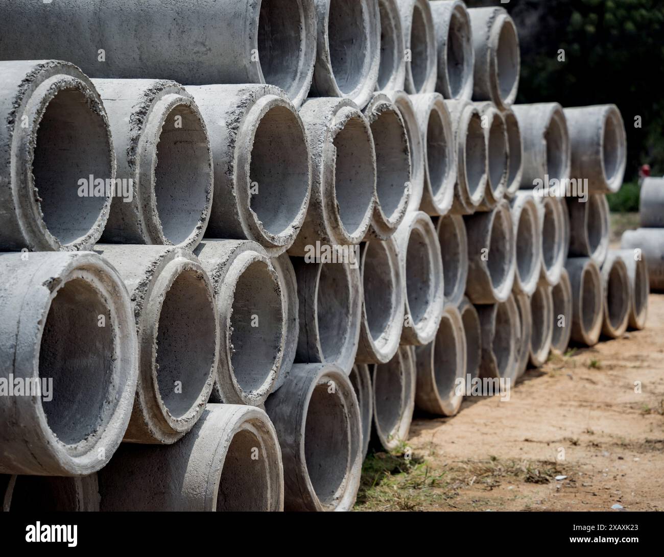 A stack of concrete ring pipes piled and creating a symmetrical ...