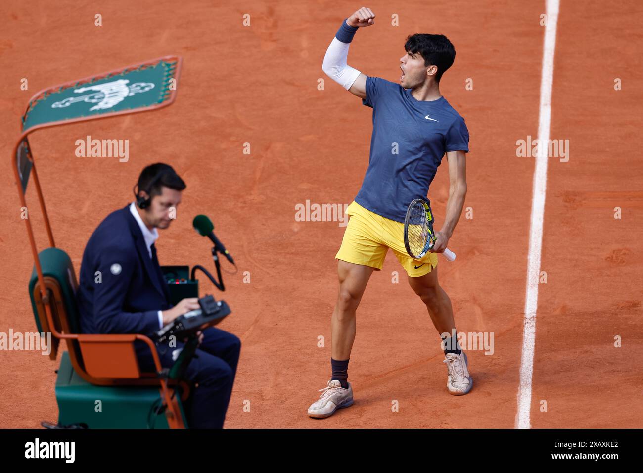 Spain's Carlos Alcaraz celebrates next to chair umpire Renaud ...