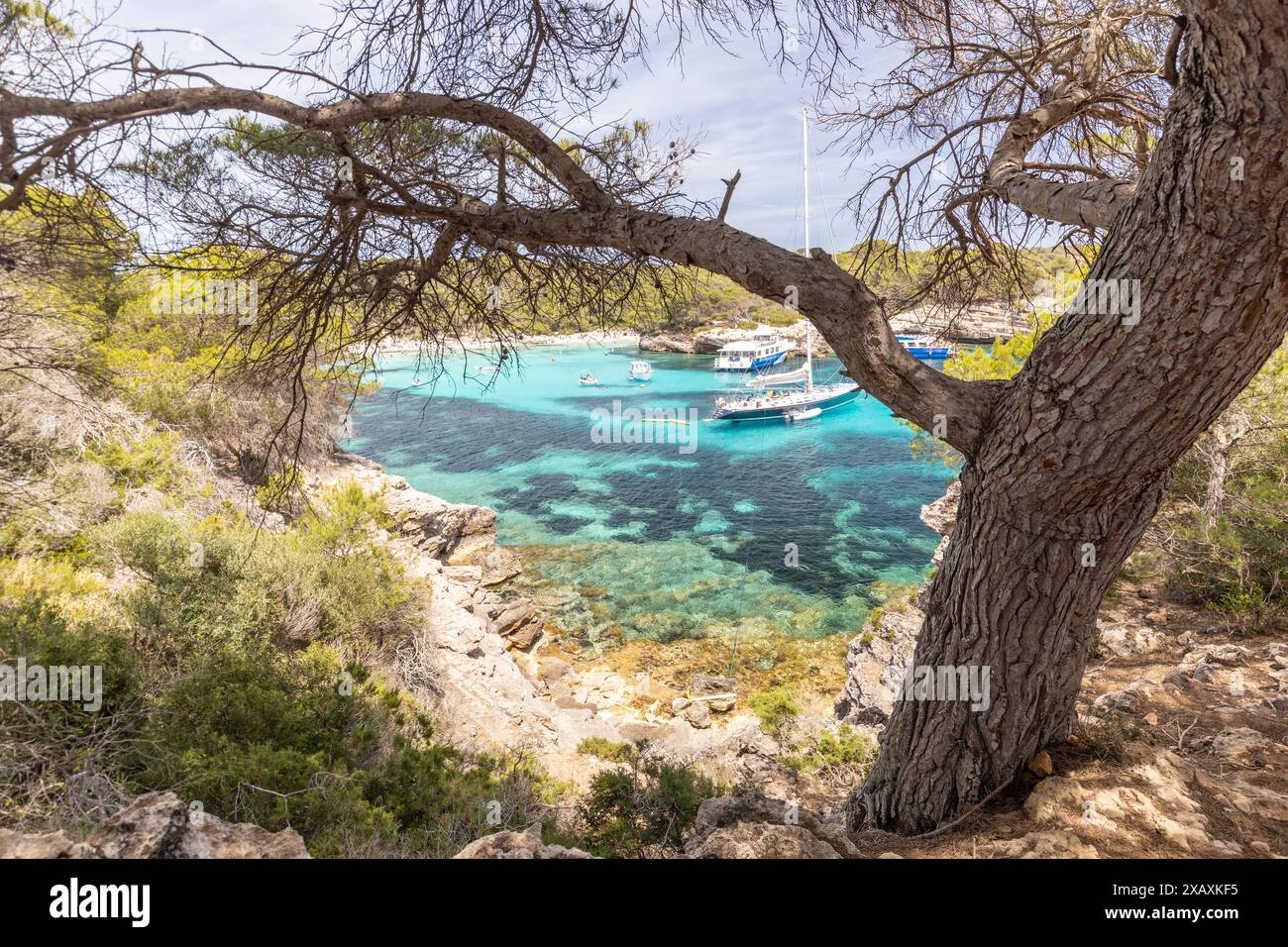 View of Turqueta beach, beautiful azure water, people sunbathing ...