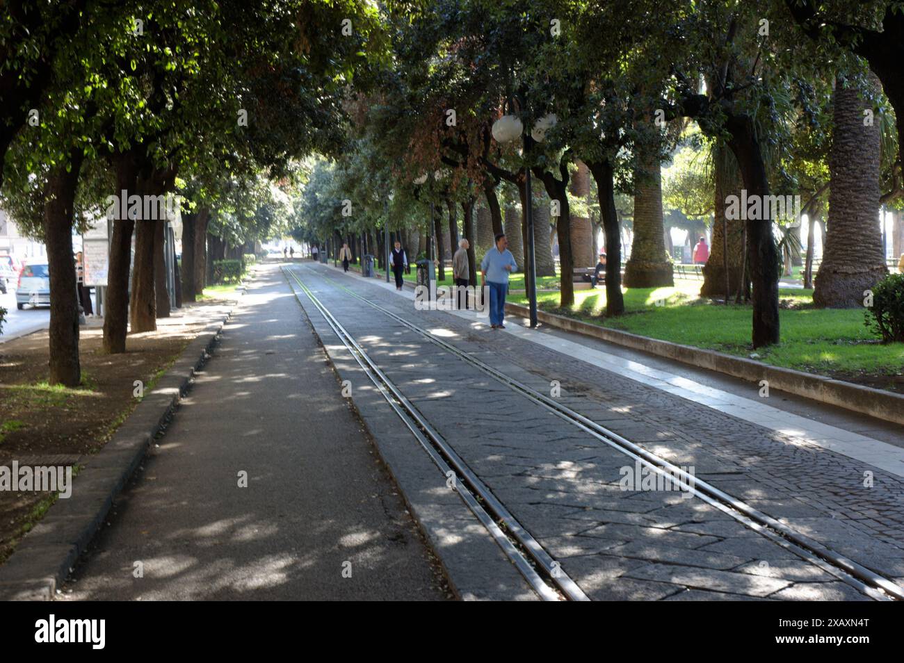Pedestrians on the Lungomare Trieste, tree-lined parkway promenade ...