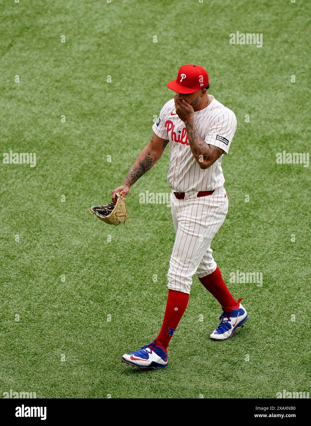 Philadelphia Phillies' Taijuan Walker walks off the field after pitching in the first innings ...