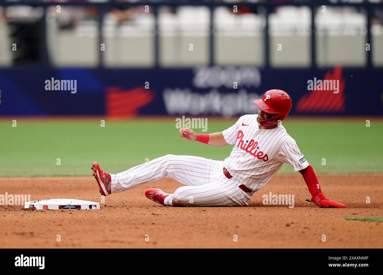 Philadelphia Phillies' Whit Merrifield slides in as he attempts to ...