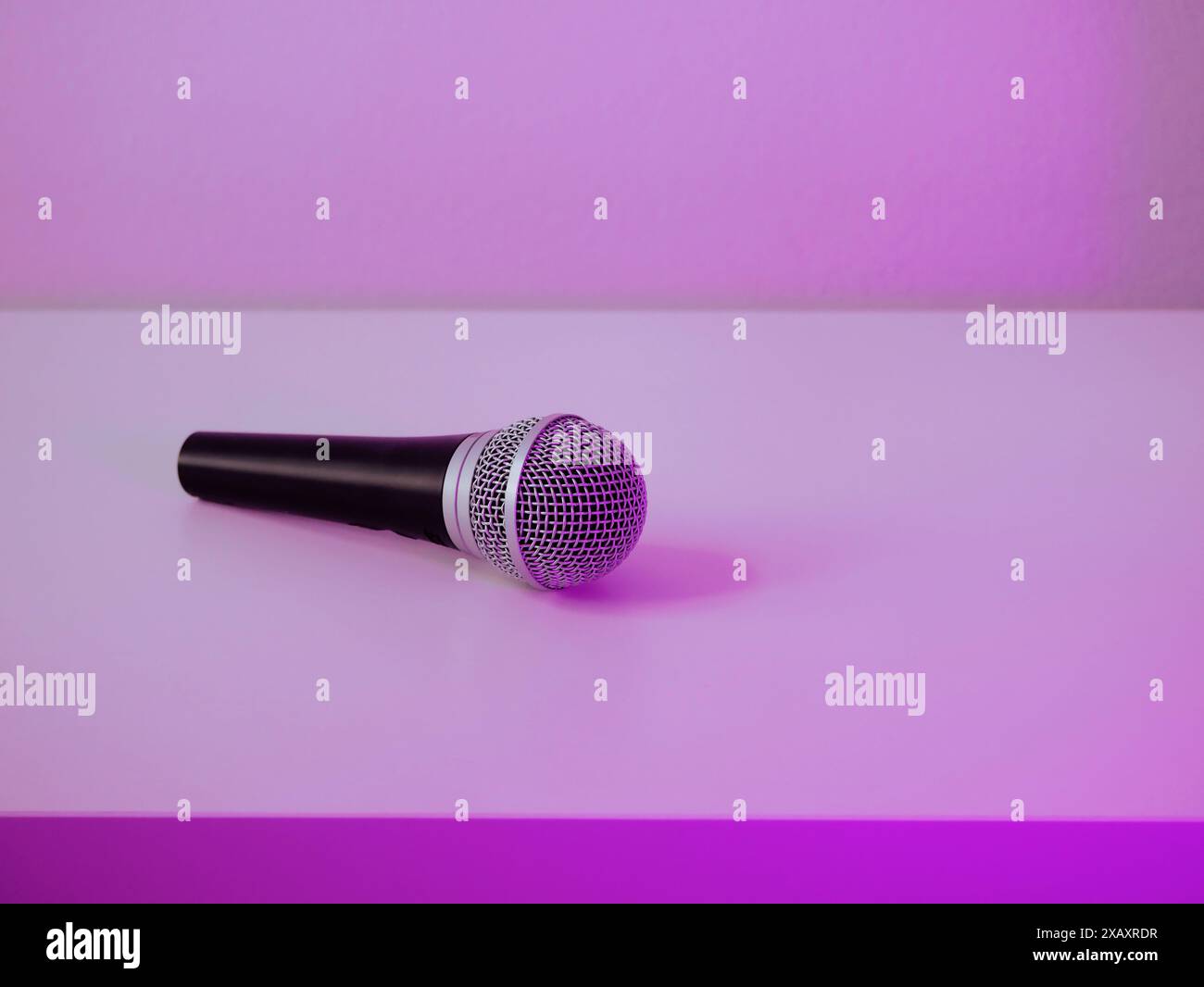 A professional microphone for sound recording or streaming lies on a ...