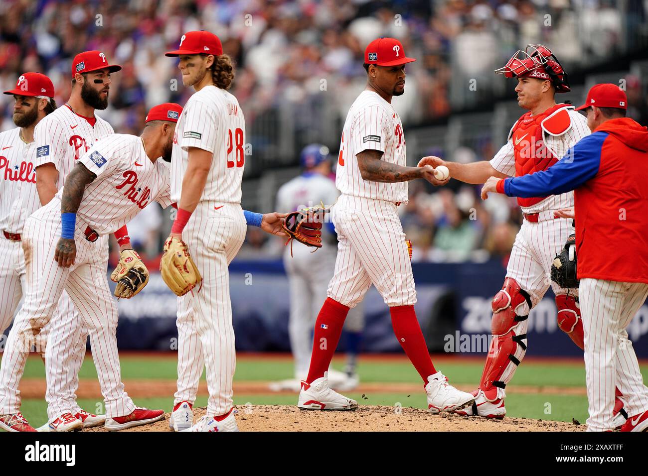 Philadelphia Phillies' Gregory Soto (centre) leaves the field following a pitching change during ...