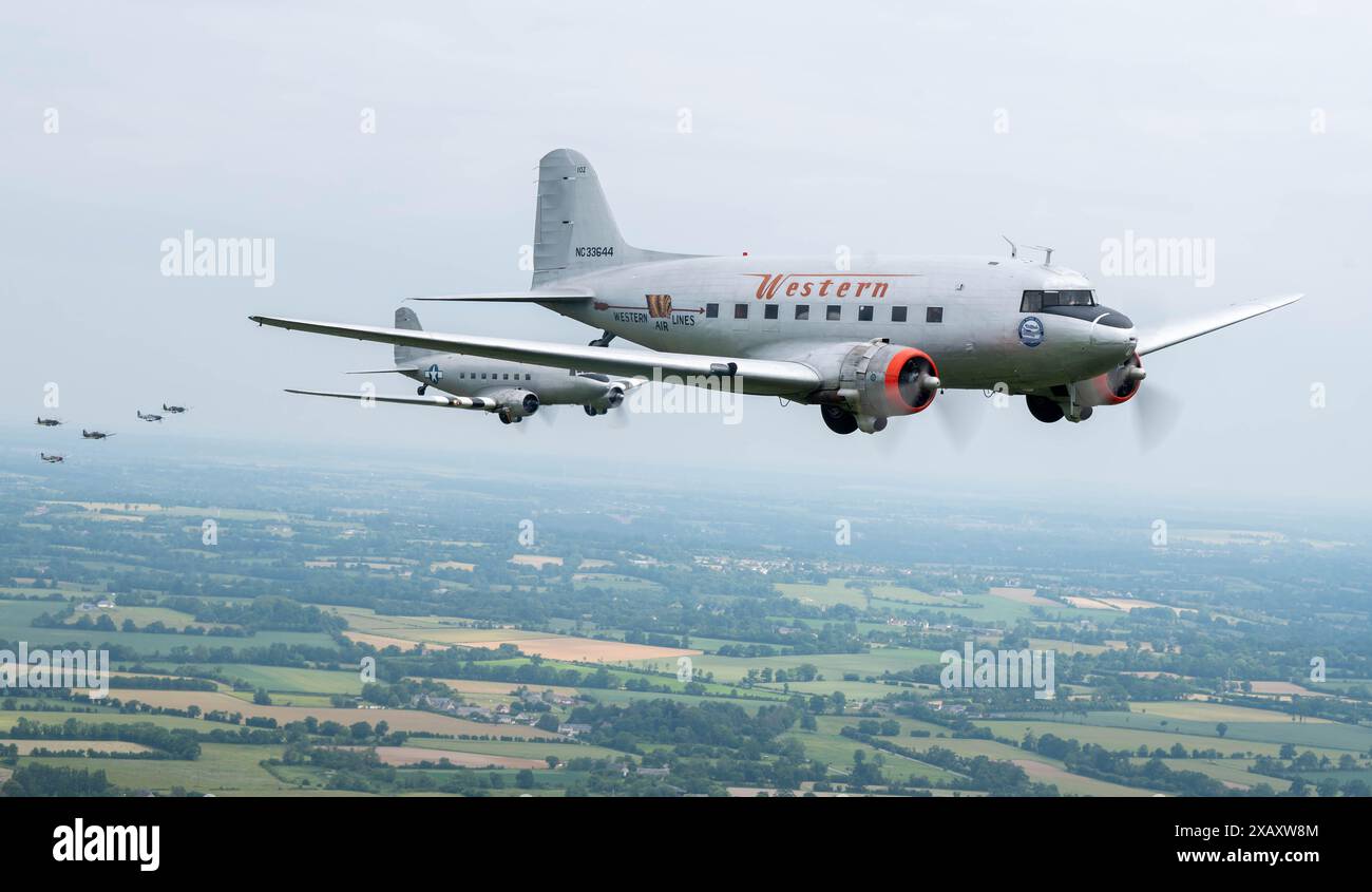 Two Douglas C-47 Skytrain aircraft fly during a commemorative flyover at Omaha Beach marking the ...