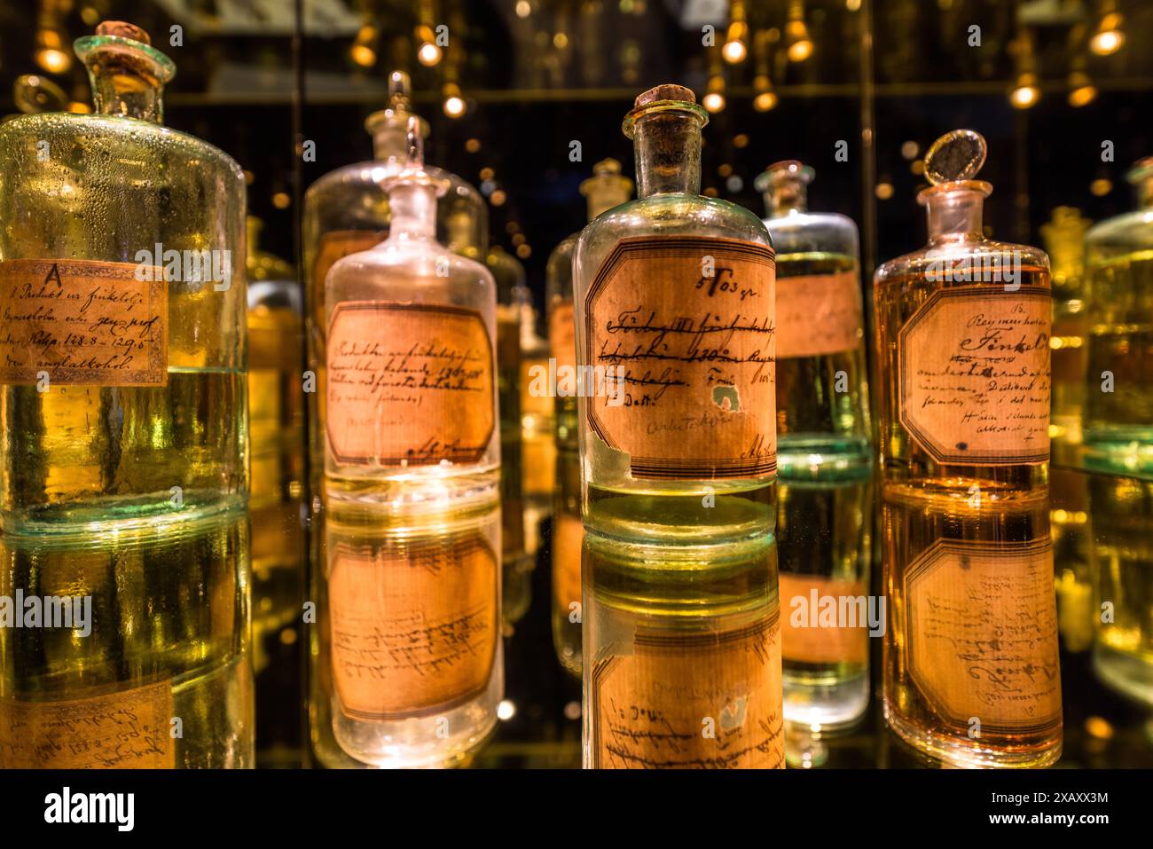 Various distillates in old glass bottles in the Stockholm Spirits ...