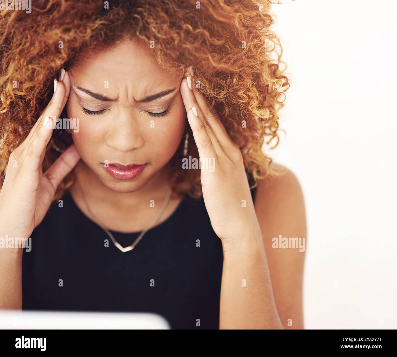 Black woman, headache and stress from work in studio with tired ...