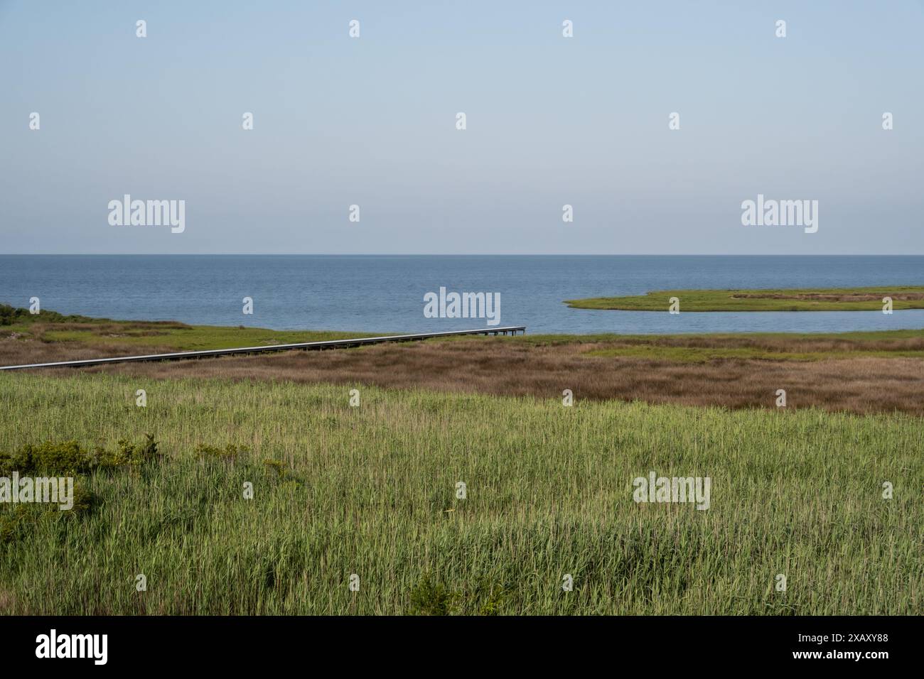 Private boardwalk jetty crossing over marshland to provide access to ...