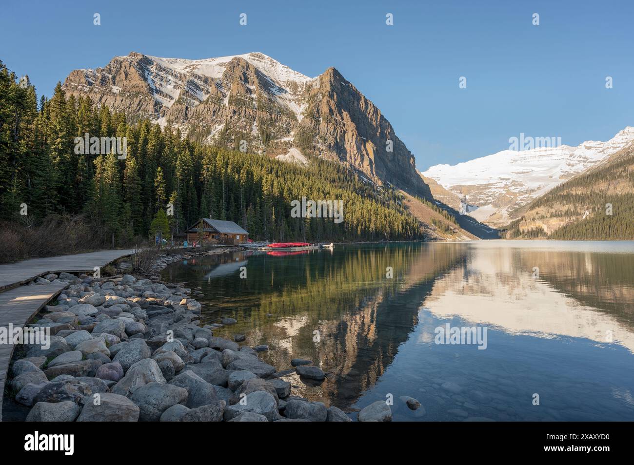 Boathouse and Mount Fairview reflected in Lake Louise in Banff National ...