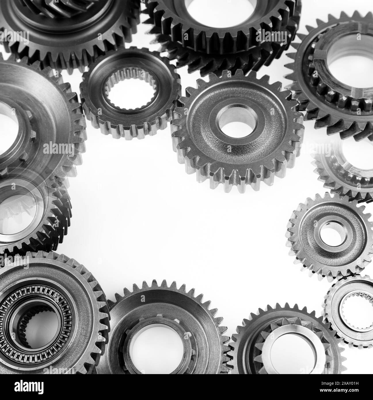 Metal cog wheel gears bonding together Stock Photo - Alamy