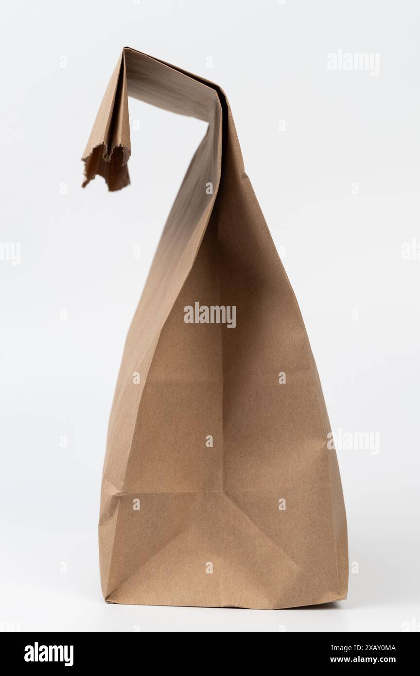 Side view of closed packing paper bag isolated on white studio ...