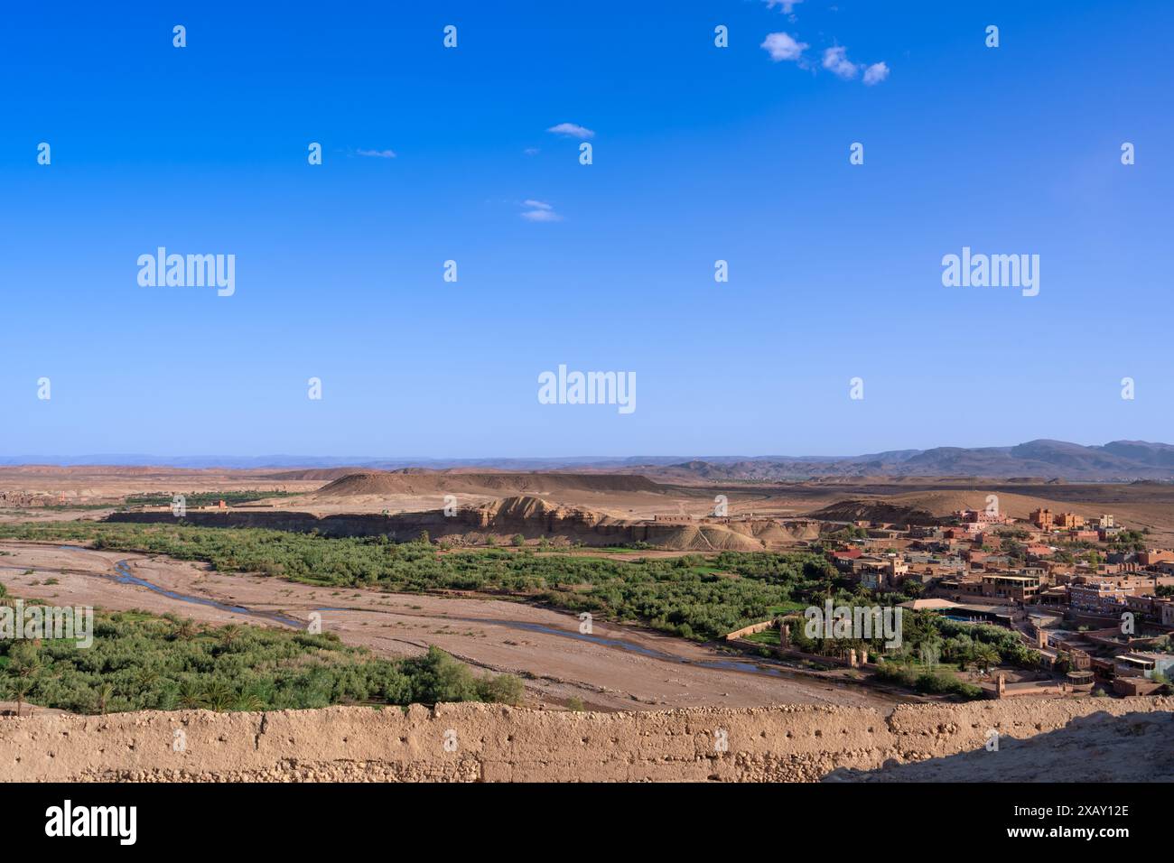 View of Ouarzazate from the Kasbah of Ait Ben Haddou. River dry season ...