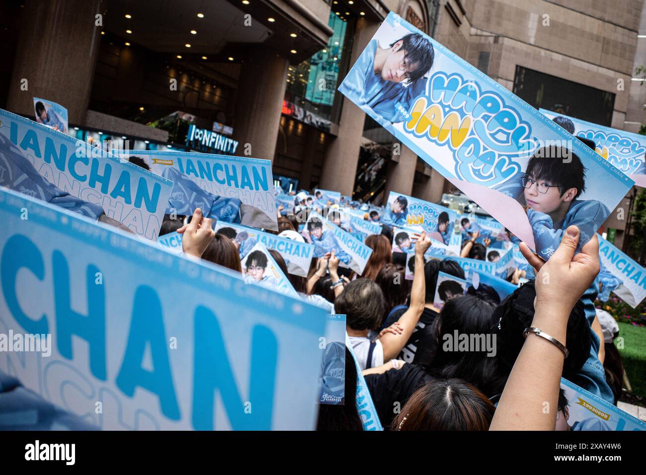 Fans of all ages hold up signs and sing Happy Birthday to Ian Chan in ...