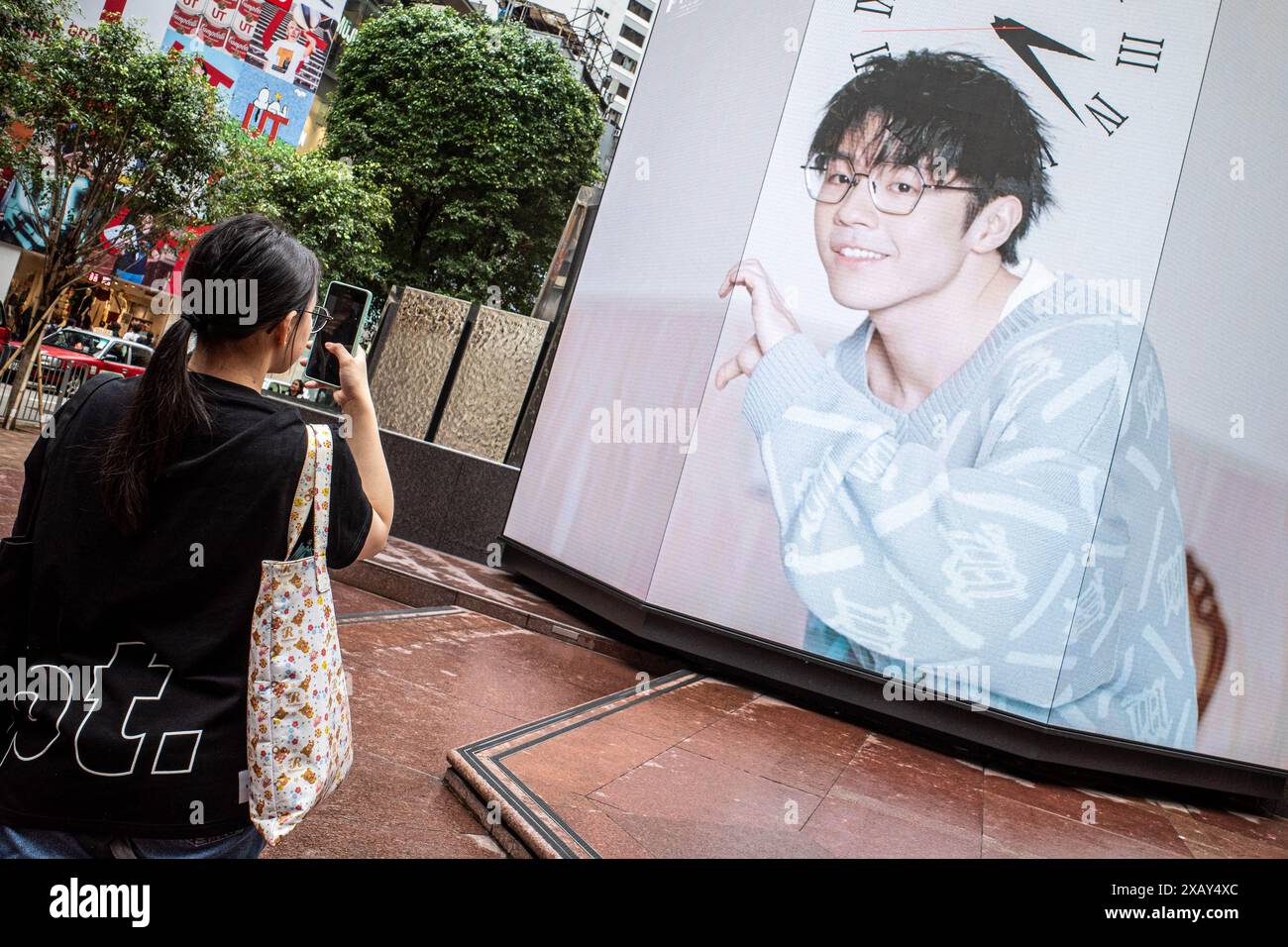 Hong Kong, China. 09th June, 2024. A young fan takes a video of an ...