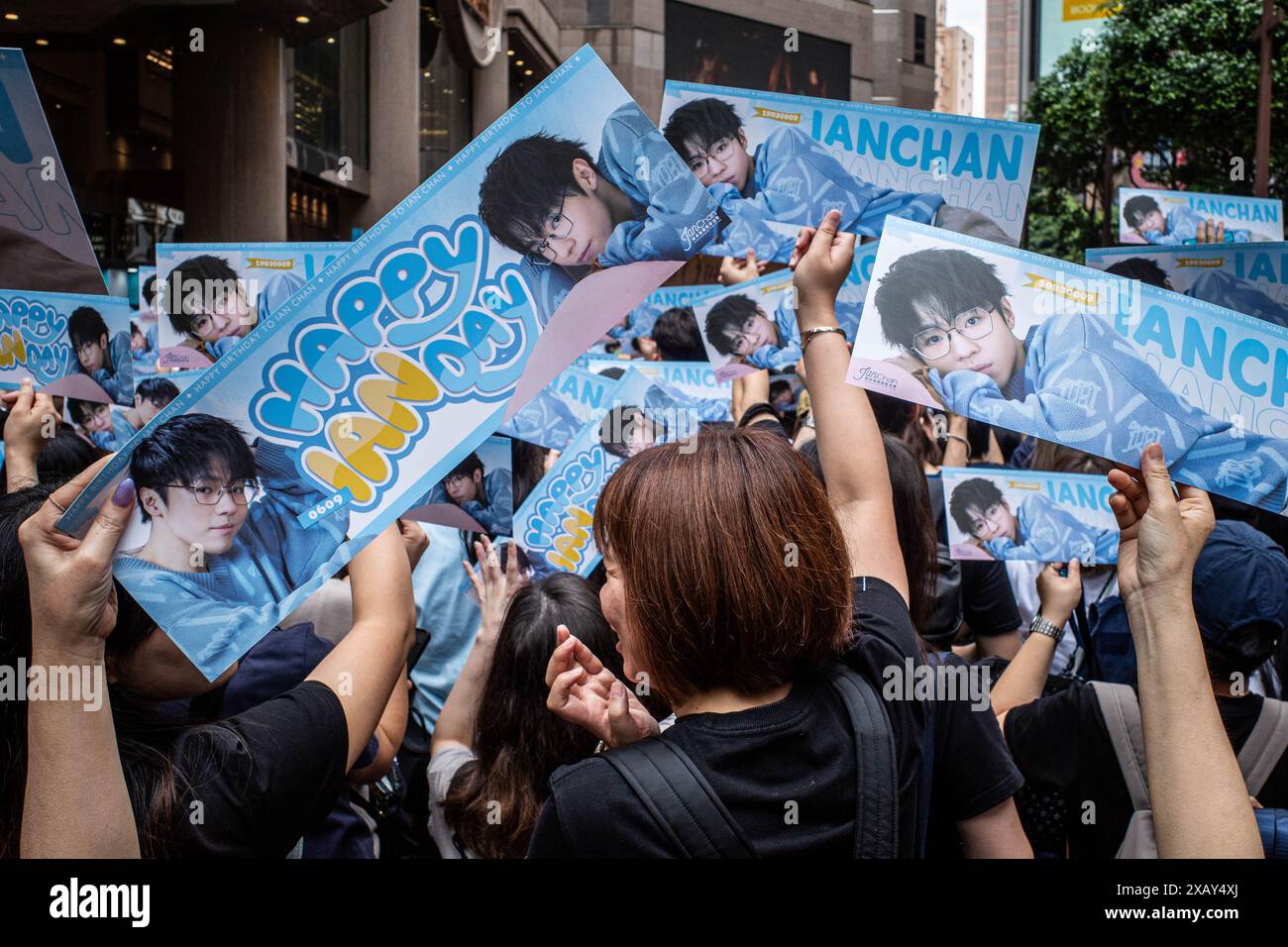Fans of all ages hold up signs and sing Happy Birthday to Ian Chan in ...