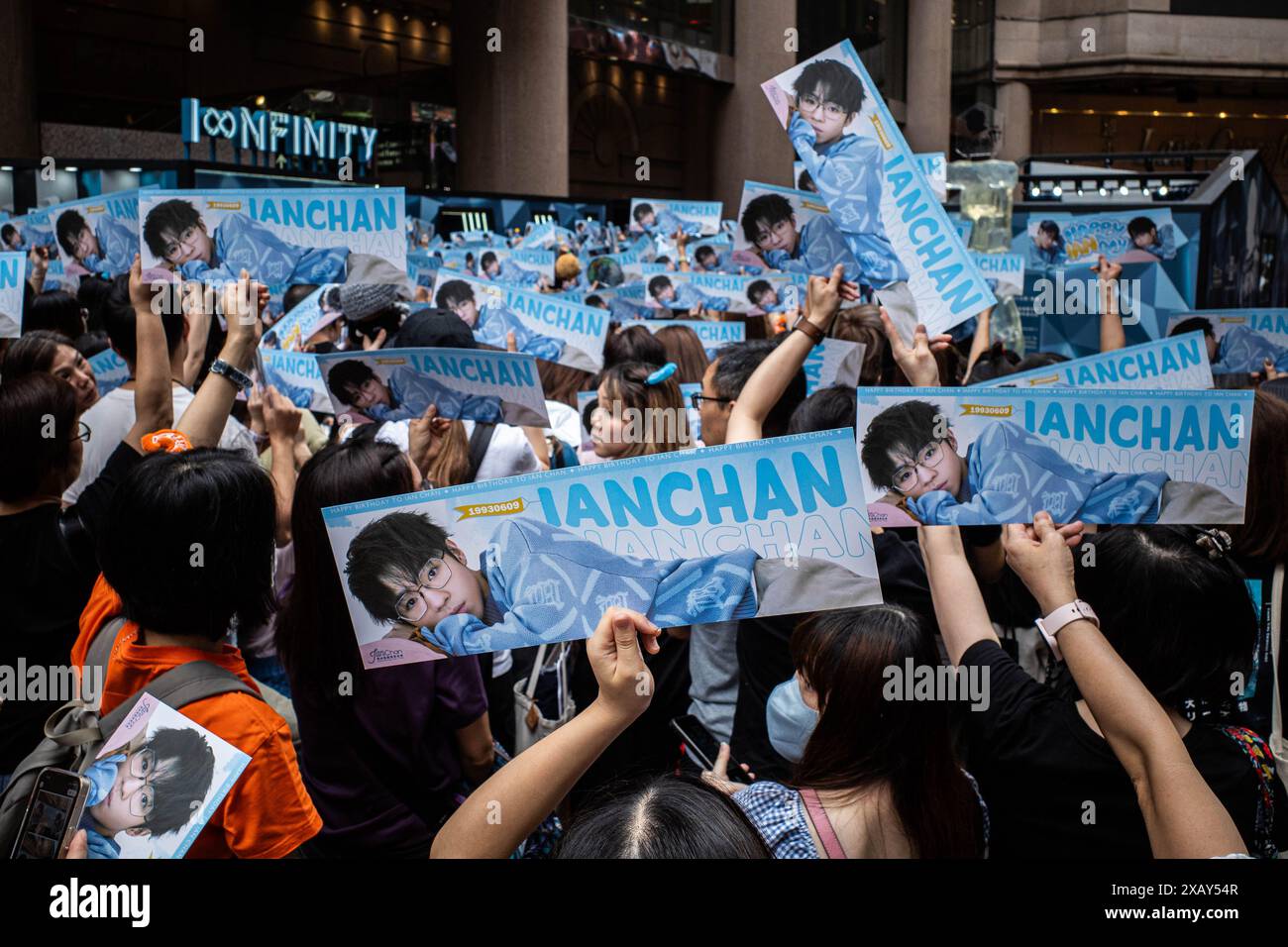 Fans of all ages hold up signs and sing Happy Birthday to Ian Chan in ...
