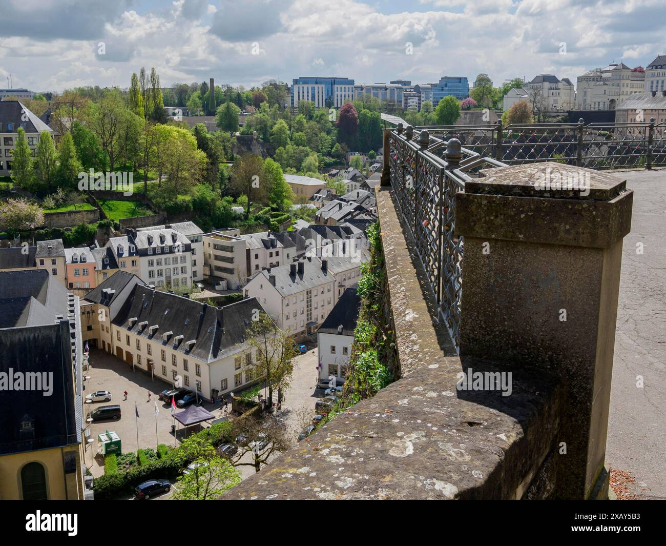 A viewpoint with railings offers a wide view of the city and the ...