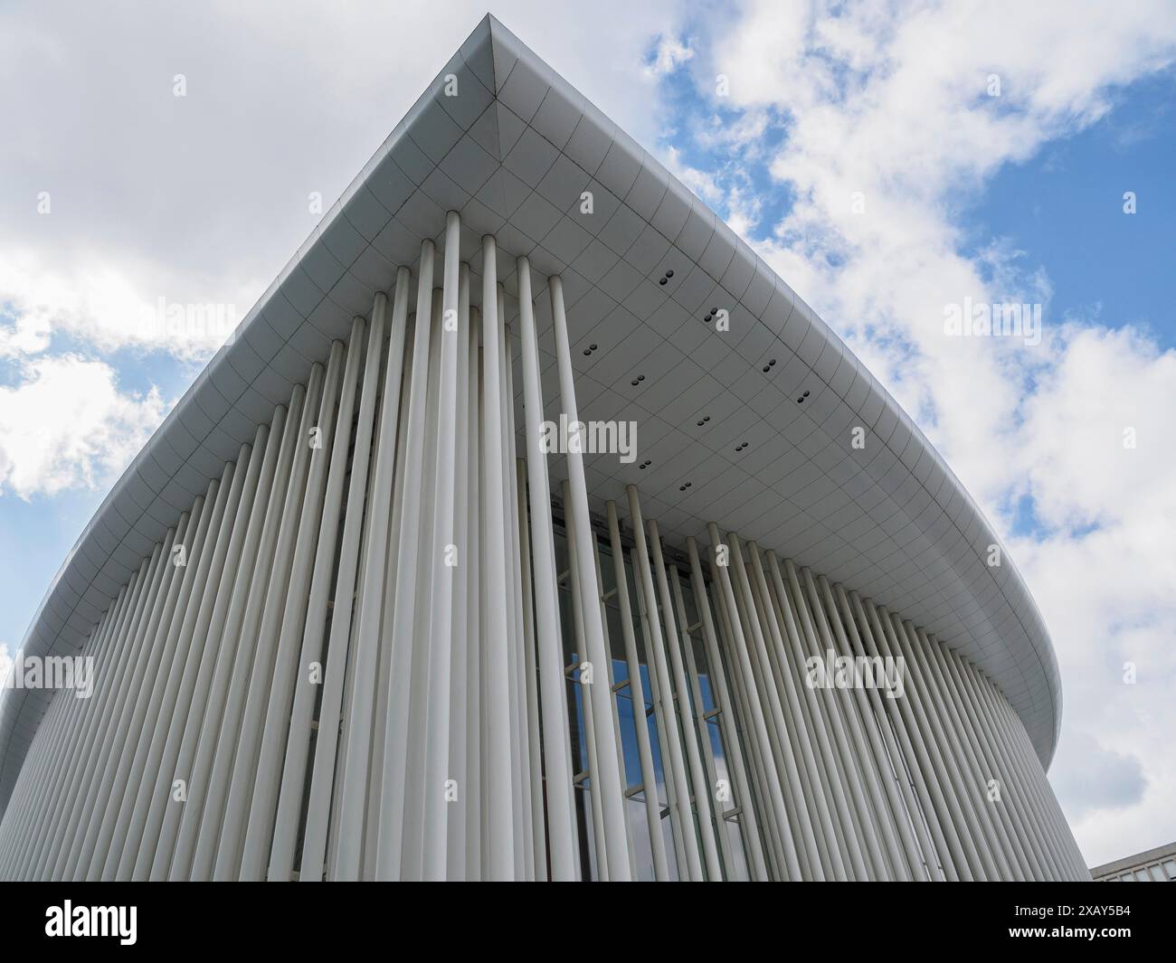 Modern architecture with white, symmetrical lines and large vertical ...