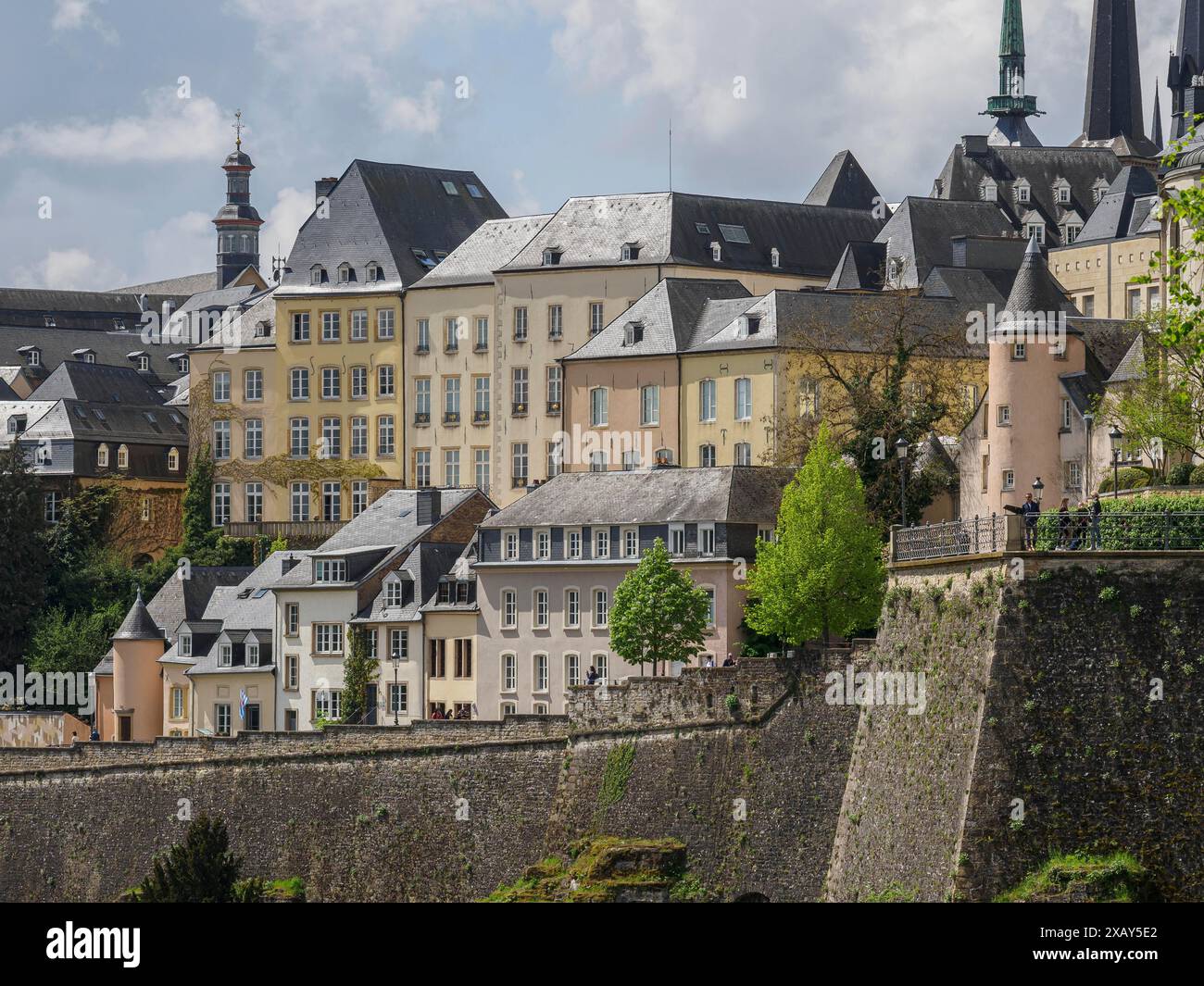 View of a historic town with houses and a wall in the foreground ...