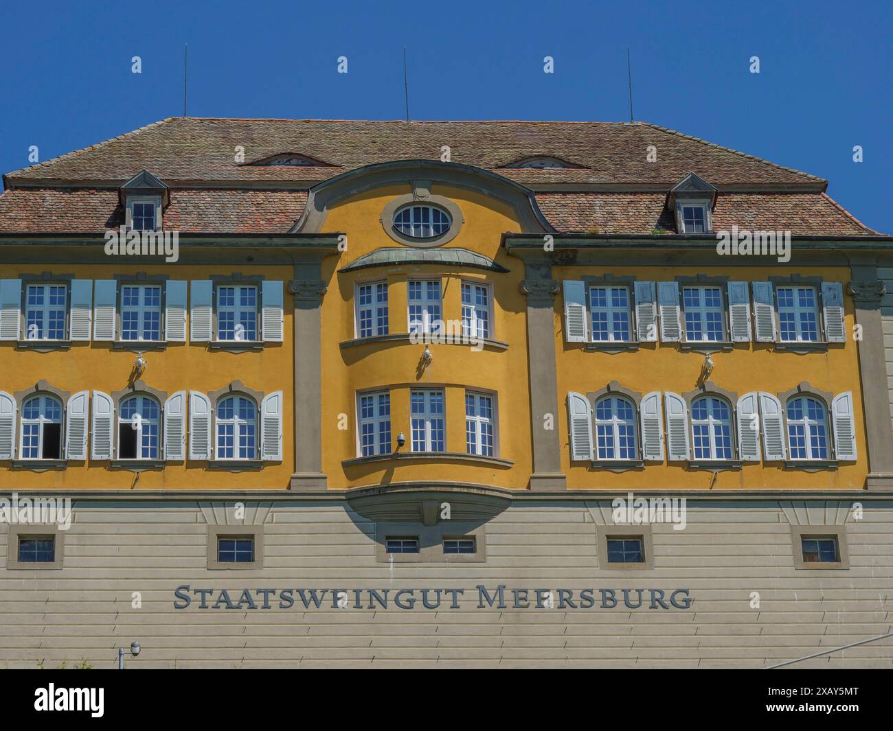 The Meersburg State Winery with its historic and eye-catching yellow ...