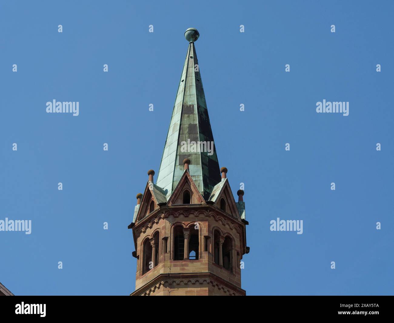 Detailed view of a Gothic church spire in front of a clear blue sky ...