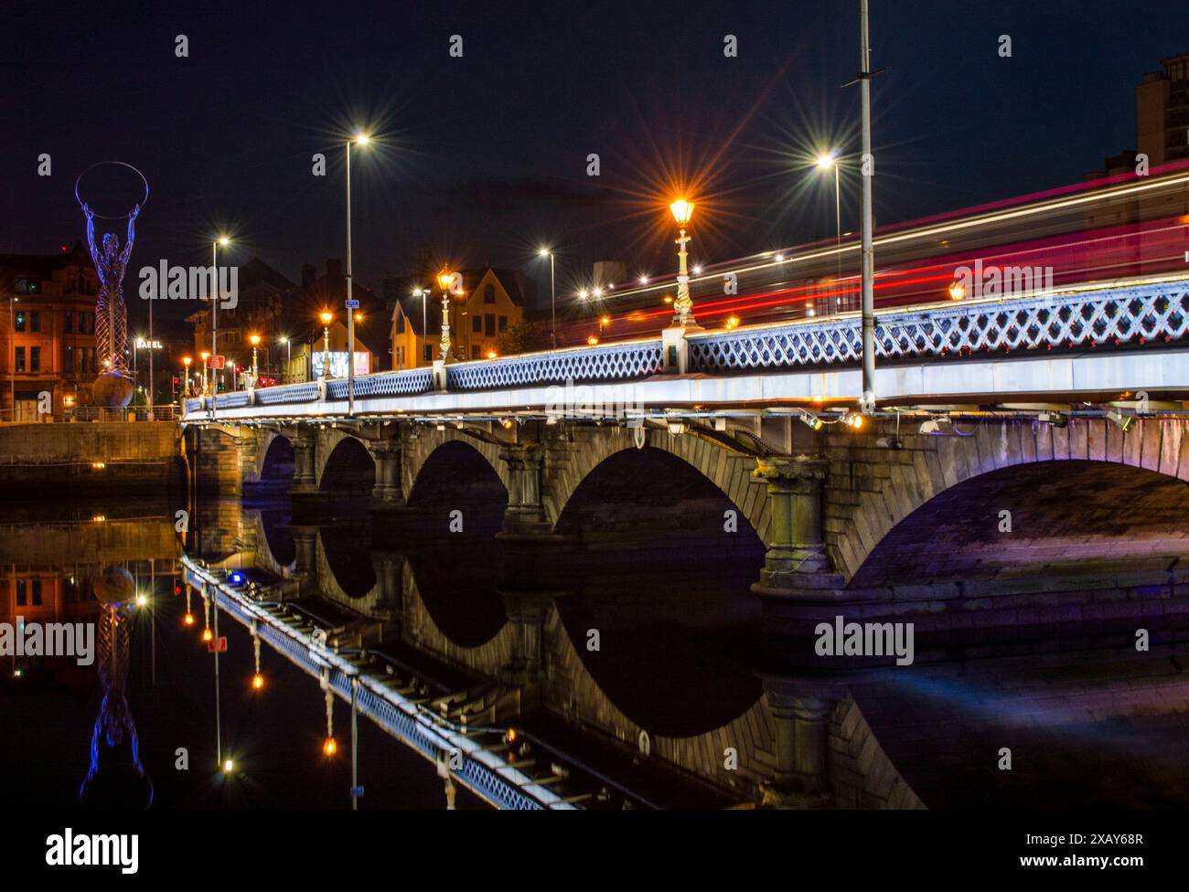 Belfast, UK, August 11, 2020. Belfast Queen's Bridge in the night with ...