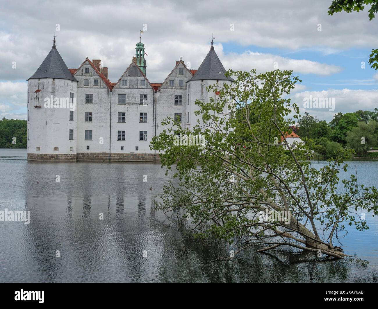 Mighty castle with white walls and striking towers, surrounded by a ...