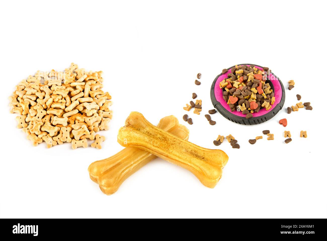 Dry food, dog biscuits and chewing bones isolated on white background ...