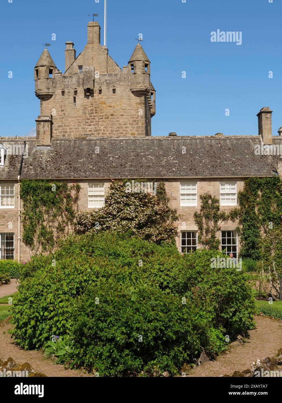 Historic building with a castle and stone walls, surrounded by a well ...
