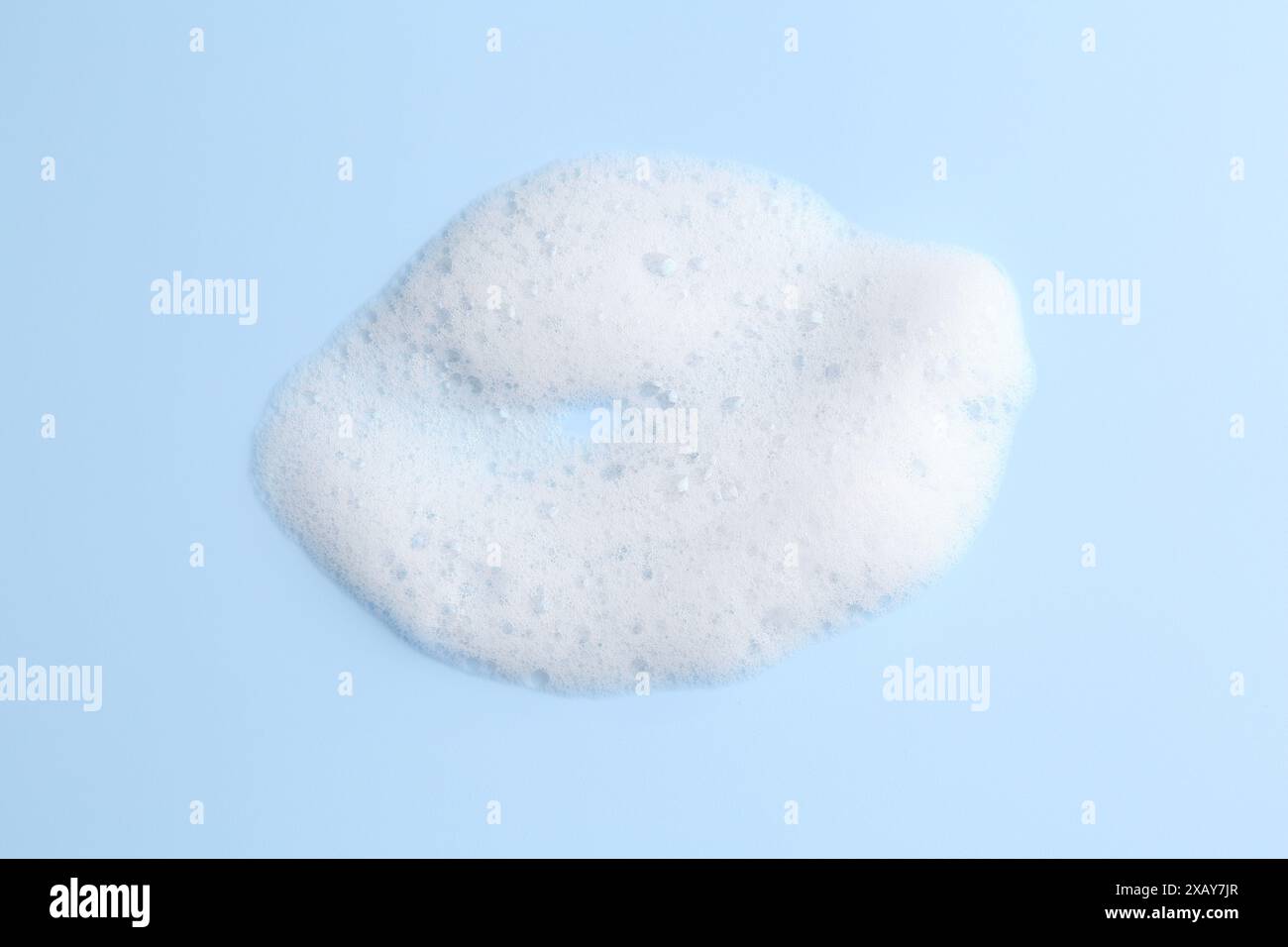 Sample of fluffy foam on light blue background, top view Stock Photo ...