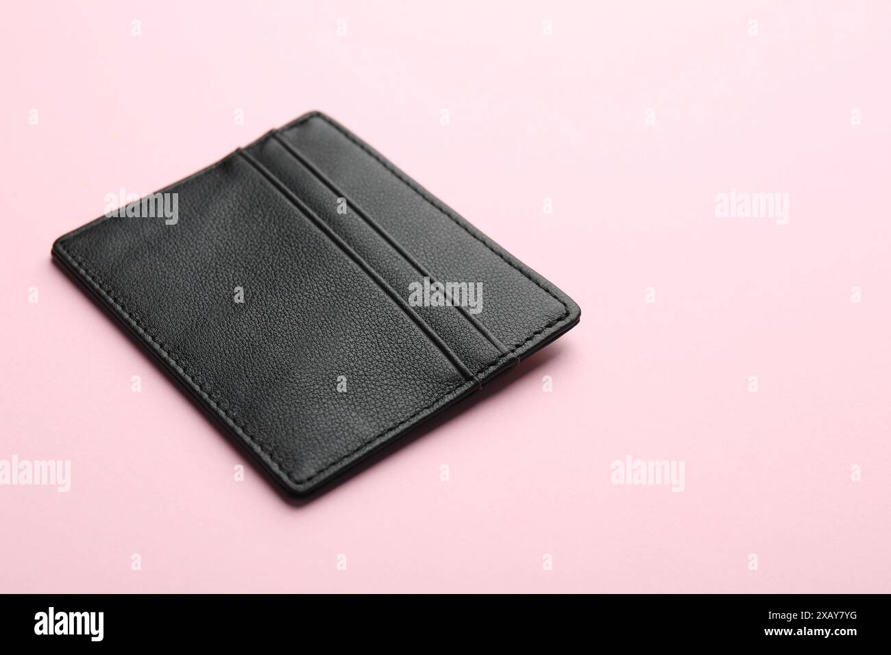 Empty leather card holder on pink background Stock Photo - Alamy