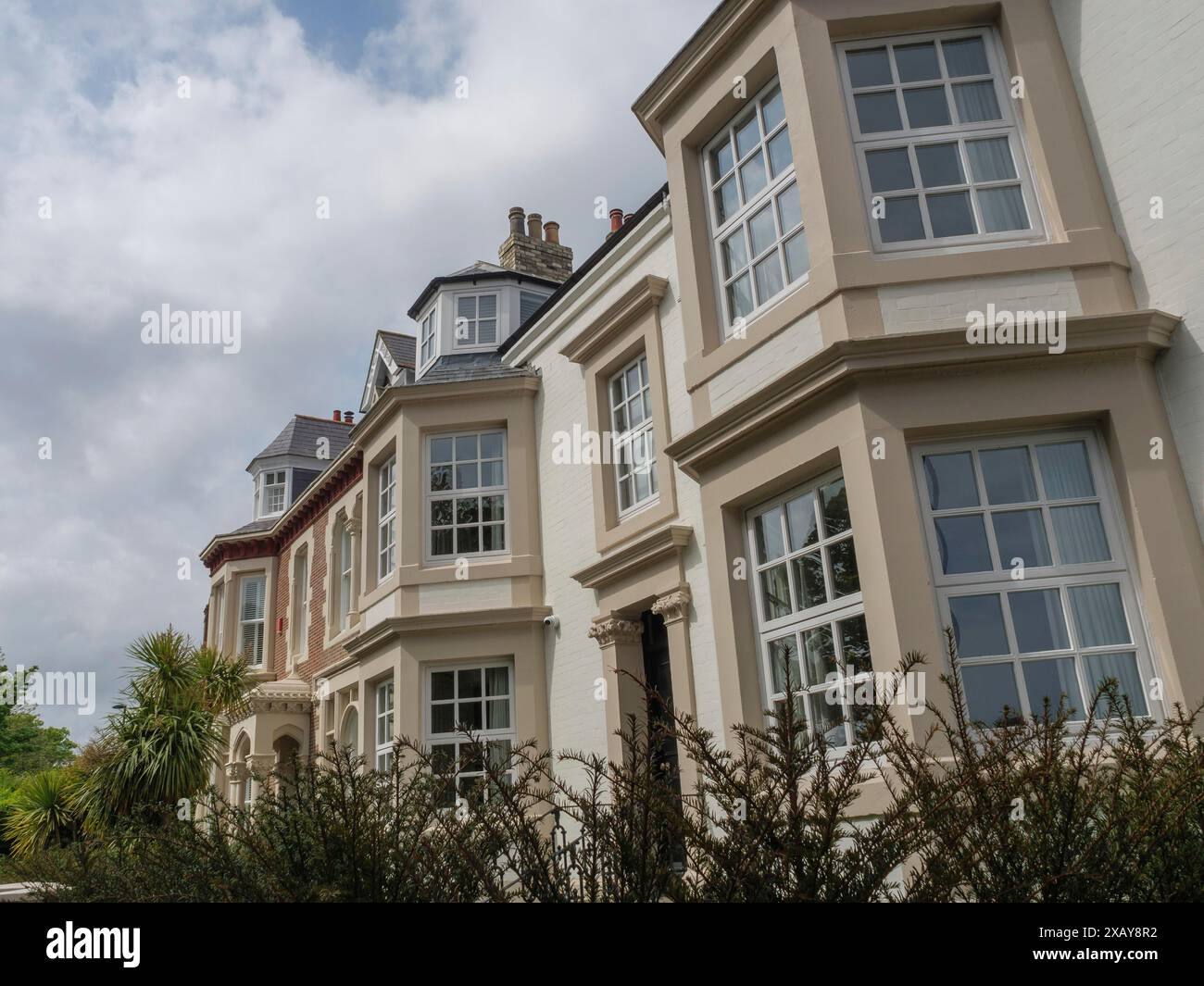 Row of well-preserved old houses with well-kept front gardens and ...