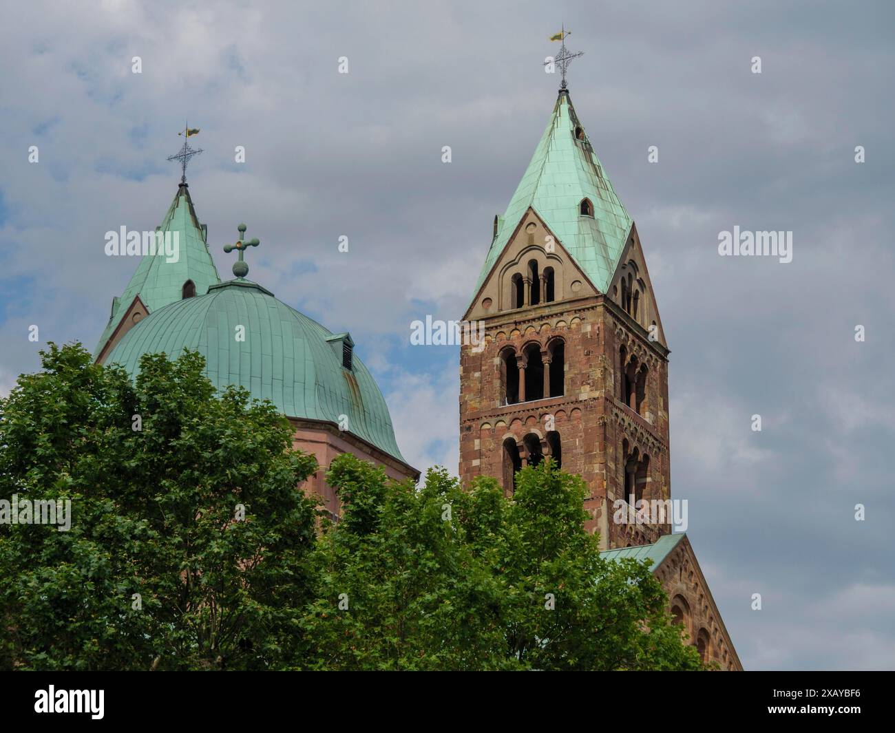 Romanesque cathedral with green roofs and striking towers in the ...