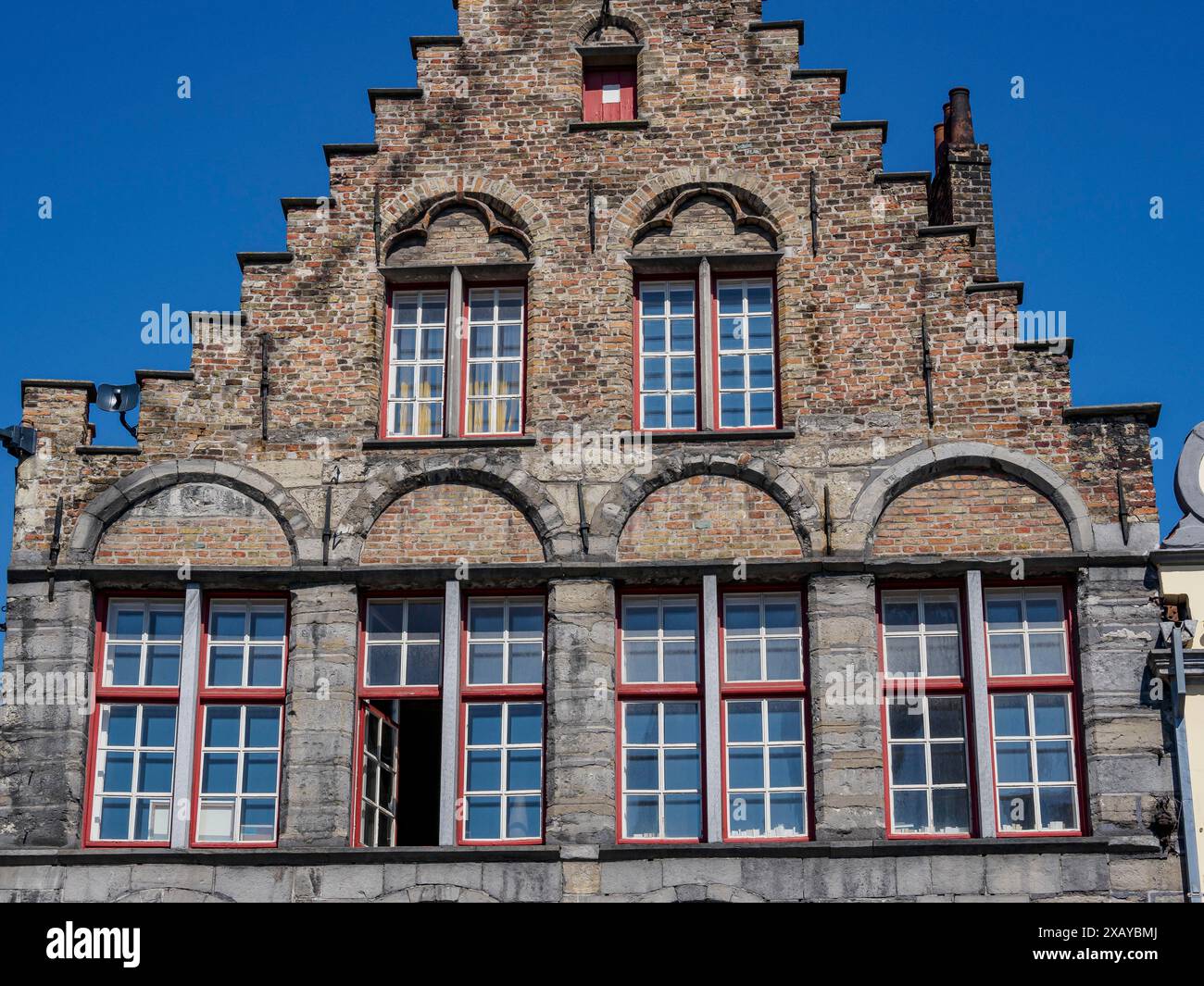 Historic building with gabled structure, brickwork and many windows ...