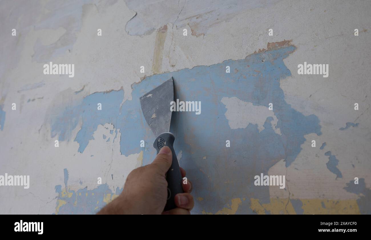 Using a paint scraper hi-res stock photography and images - Alamy