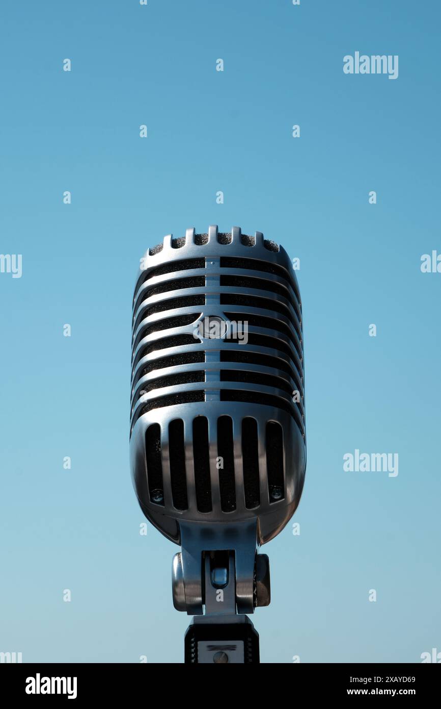 retro microphone on blue background, microphone against the sky Stock ...