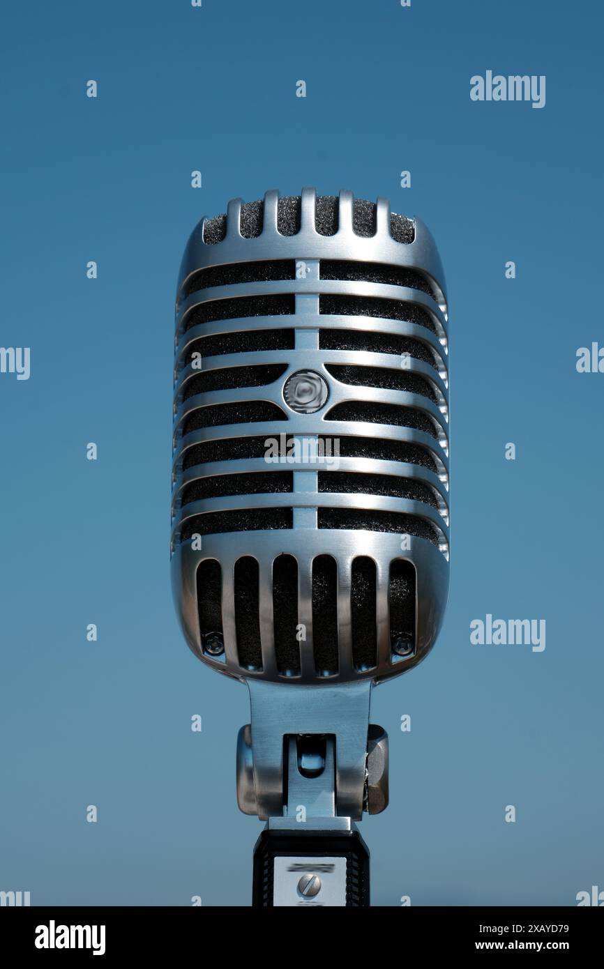 retro microphone on blue background, microphone against the sky Stock ...