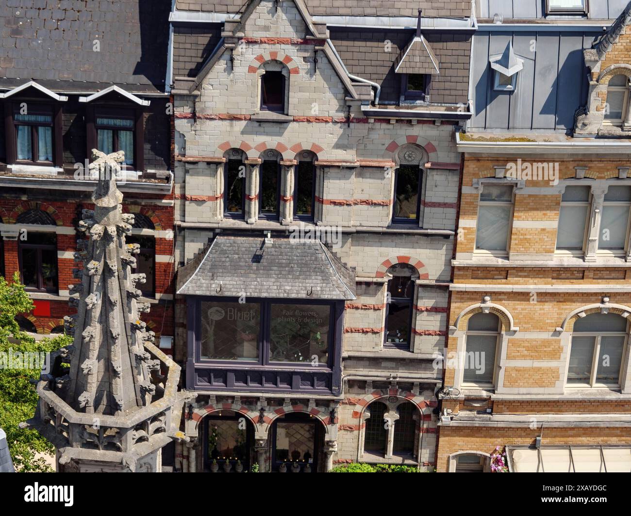 Multi-storey building with historic facades and decorative windows ...