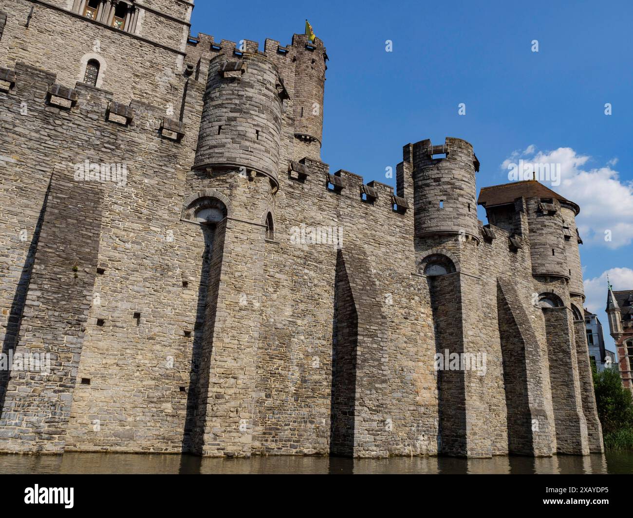 Massive castle walls with towers, built in medieval architectural style ...
