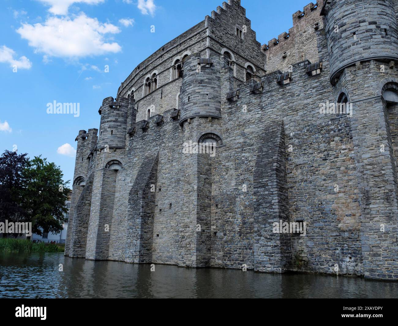 Mighty medieval castle made of grey stone with high walls and a ...