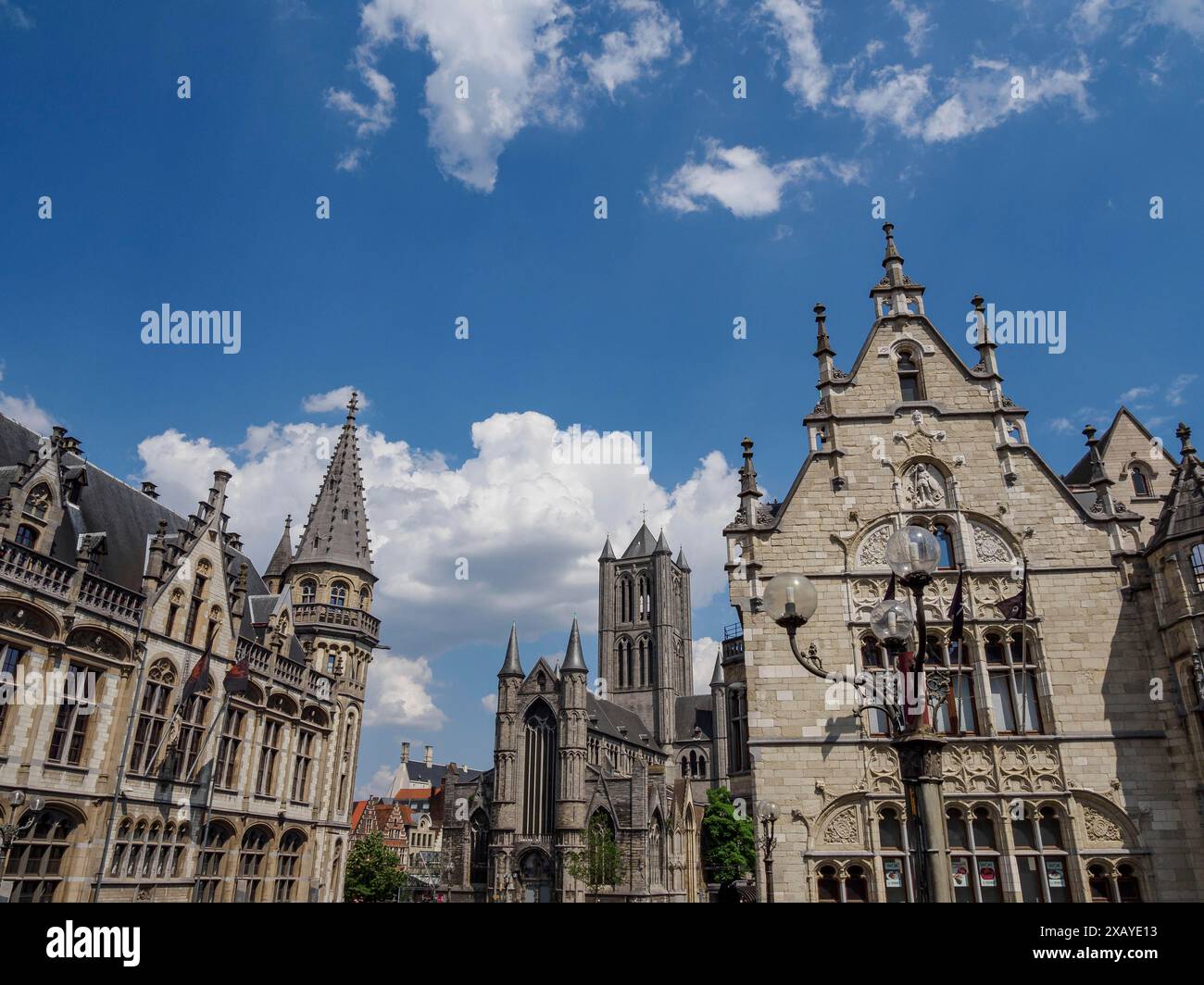 Historic Gothic-style buildings with towers and a blue sky in the ...