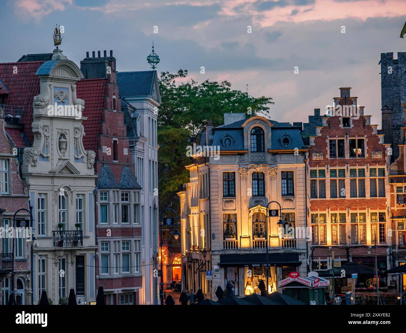 Atmospheric old town scene with illuminated historic facades at dusk ...