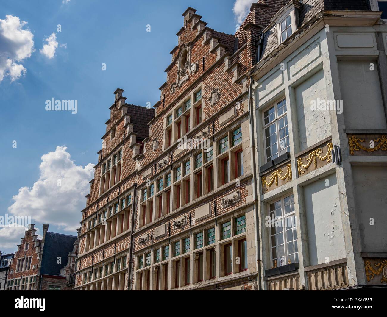 Detailed view of facades of historic buildings under a bright blue sky ...