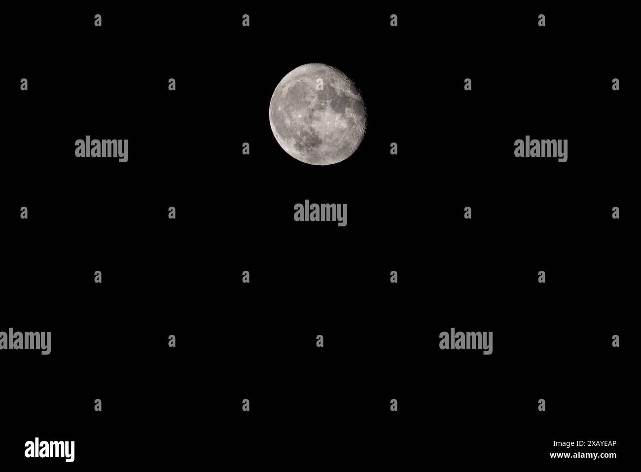 Lunar Majesty: Telephoto Capture of Full Moon.A telephoto lens reveals ...