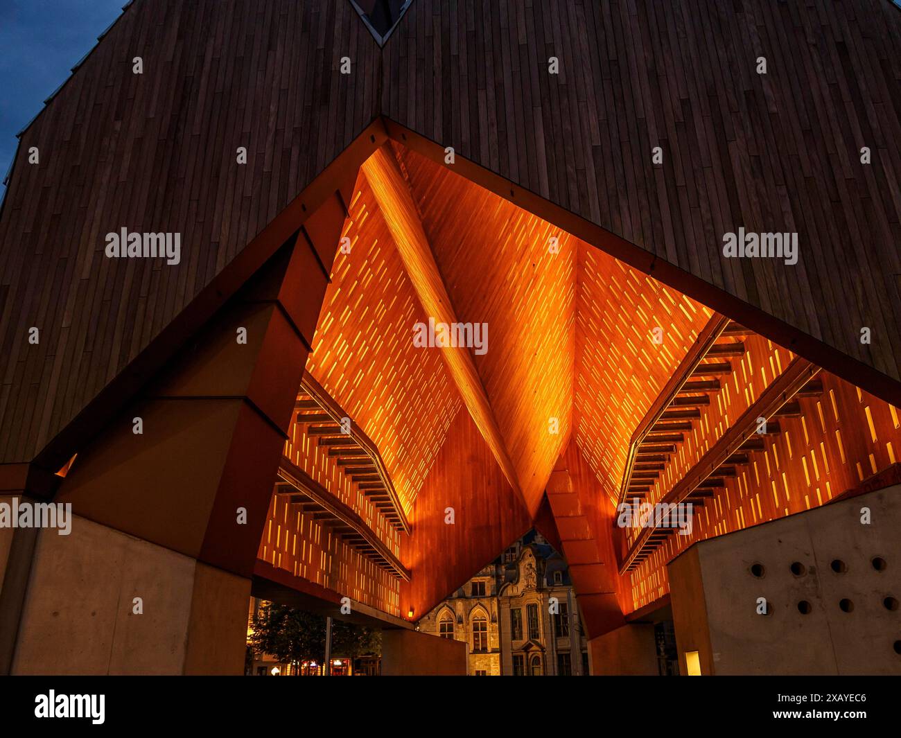 Modern building with illuminated wooden roof and unique geometric ...